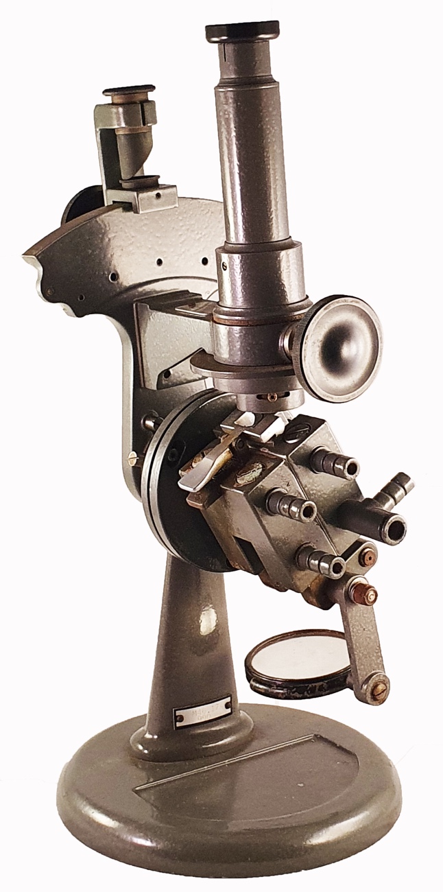 A close-up of a microscopeDescription automatically generated with ...